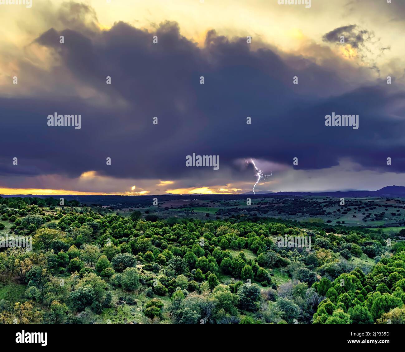 Dark cloud storm beam. Dramatic rainy sky over the tree field. Madrid ...