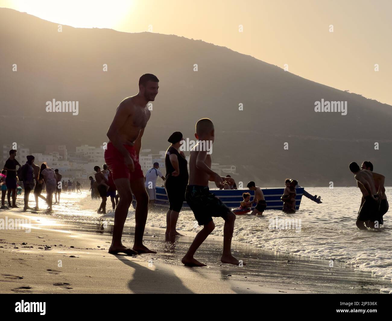 People enjoying their summer holiday on the beach Stock Photo - Alamy