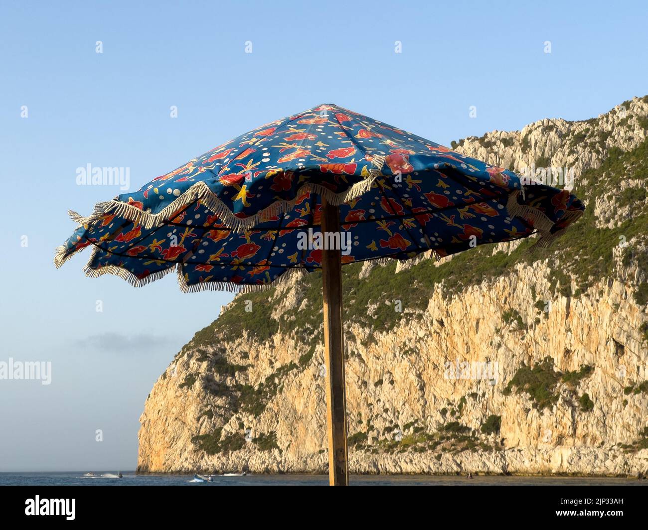 Textile parasol open with blue sky Stock Photo - Alamy