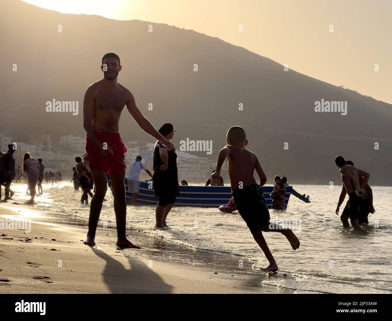 People enjoying their summer holiday on the beach Stock Photo - Alamy