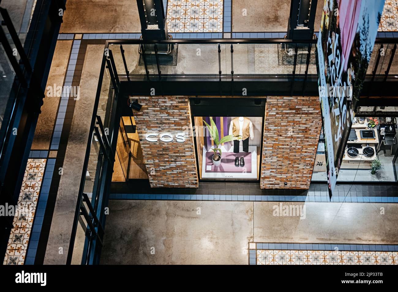 Cos shop boutique in city shopping gallery. Signboard logo brand sign ...