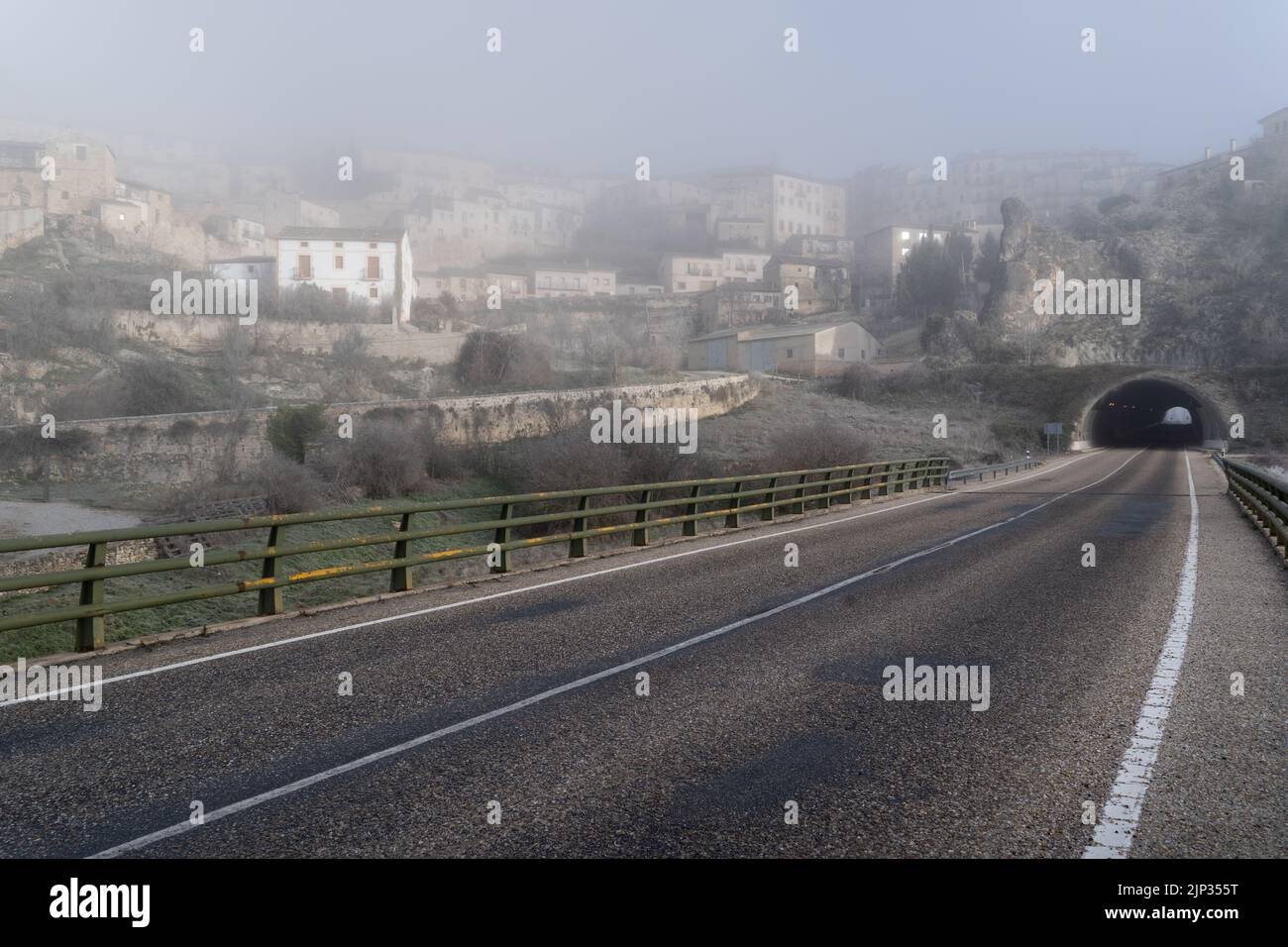 Road to tunnel with houses at the top of the mountain, landscape of ...