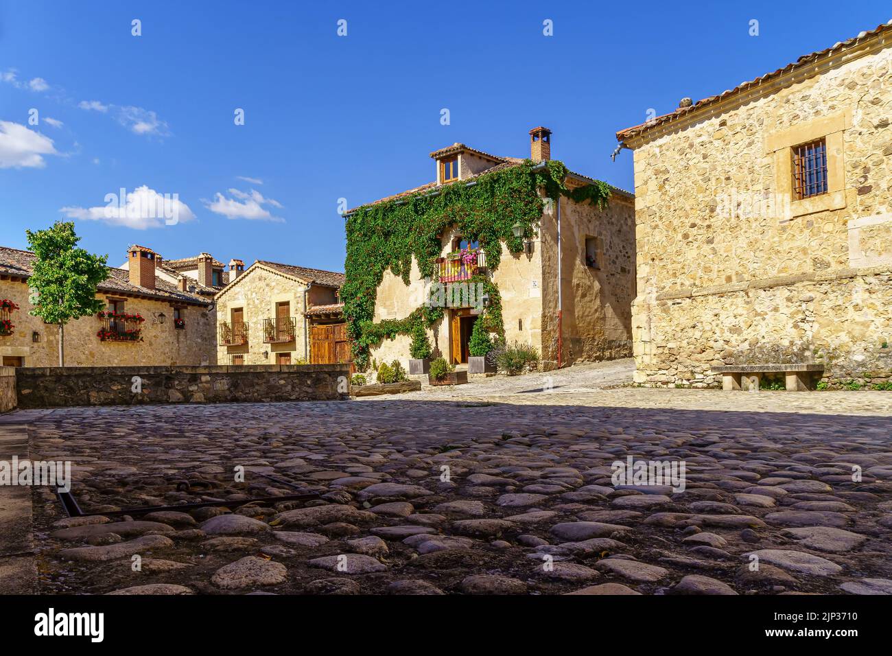 Medieval old town with stone houses, old doors and windows, cobbled ...