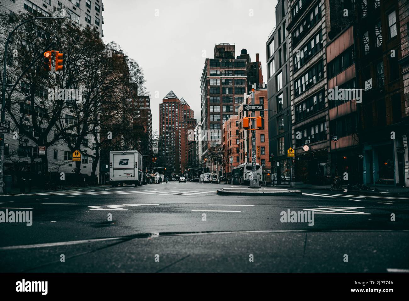 An empty street with modern buildings in New York City, after the rain ...