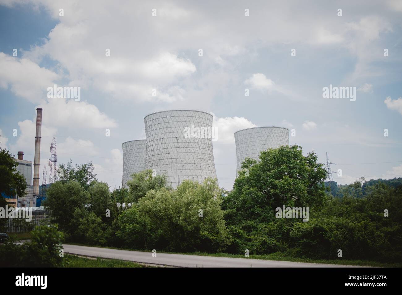The Nuclear reactor behind the road with trees Stock Photo - Alamy