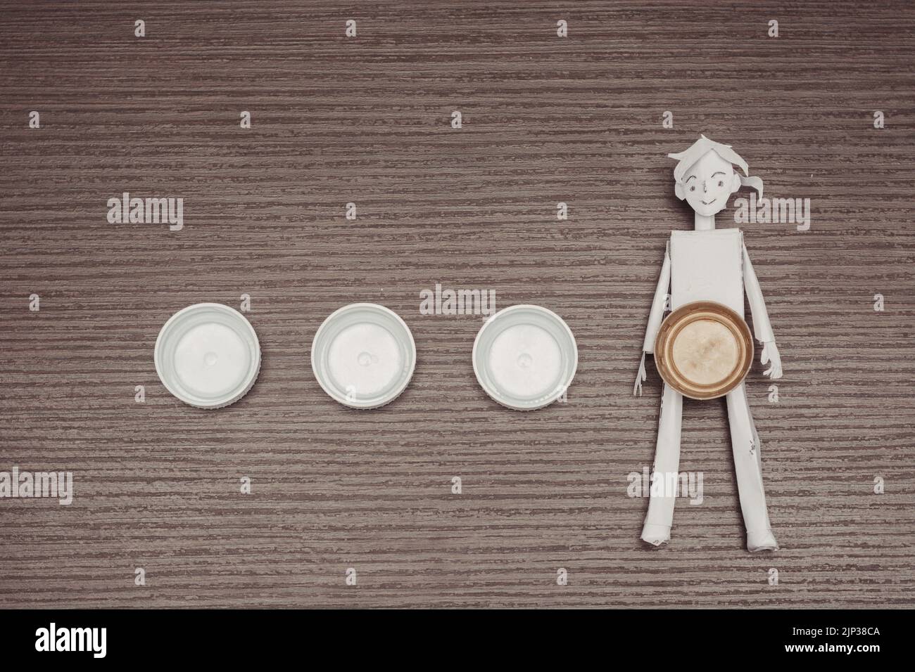 paper man choosing a golden token, metaphor of the best possible choice ...