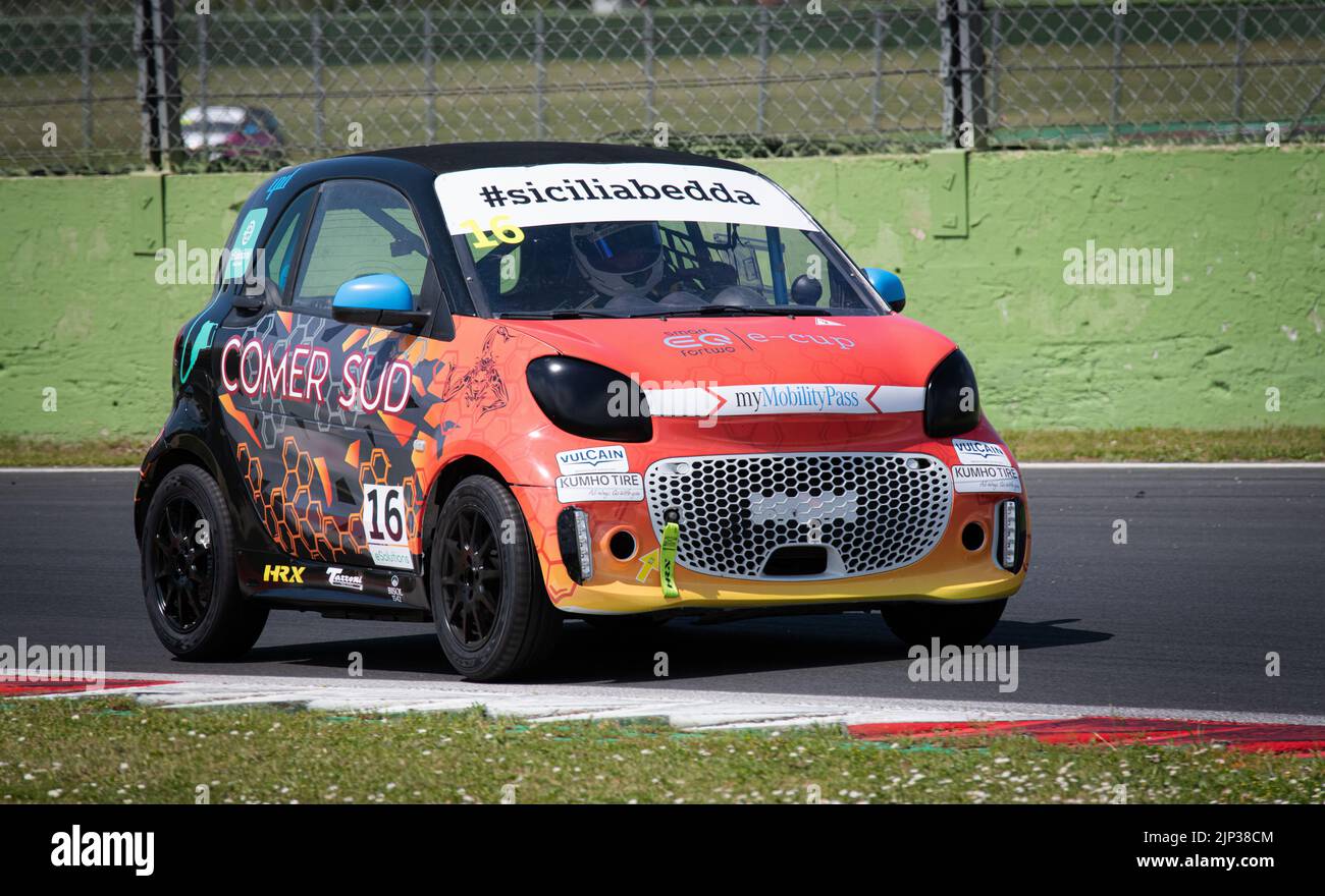 Racing Smart electric mini car action challenging on racetrack ...