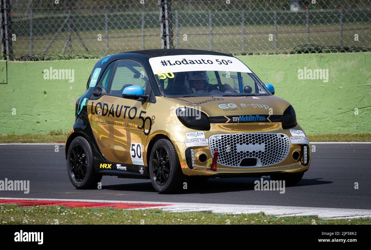 Racing Smart electric mini car action challenging on racetrack ...