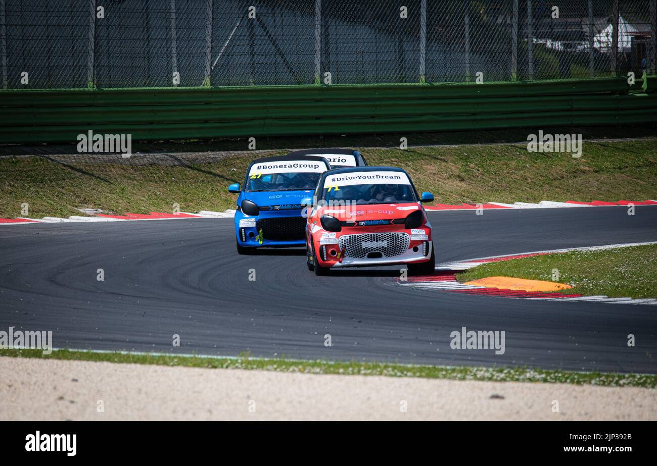 Racing Smart electric mini car action challenging on racetrack ...