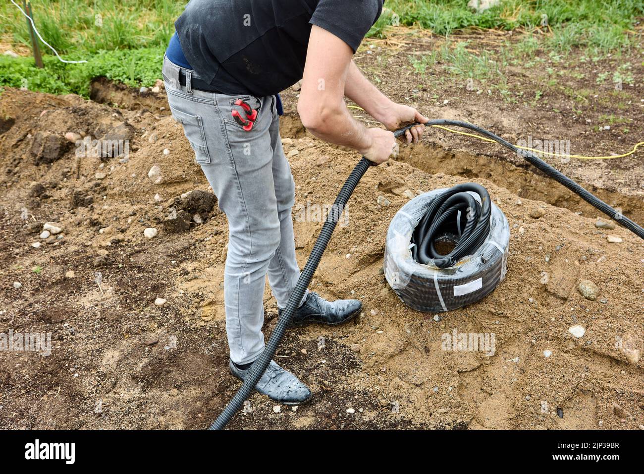 Cable laying along bottom of trench, cabling in countryside Stock Photo ...