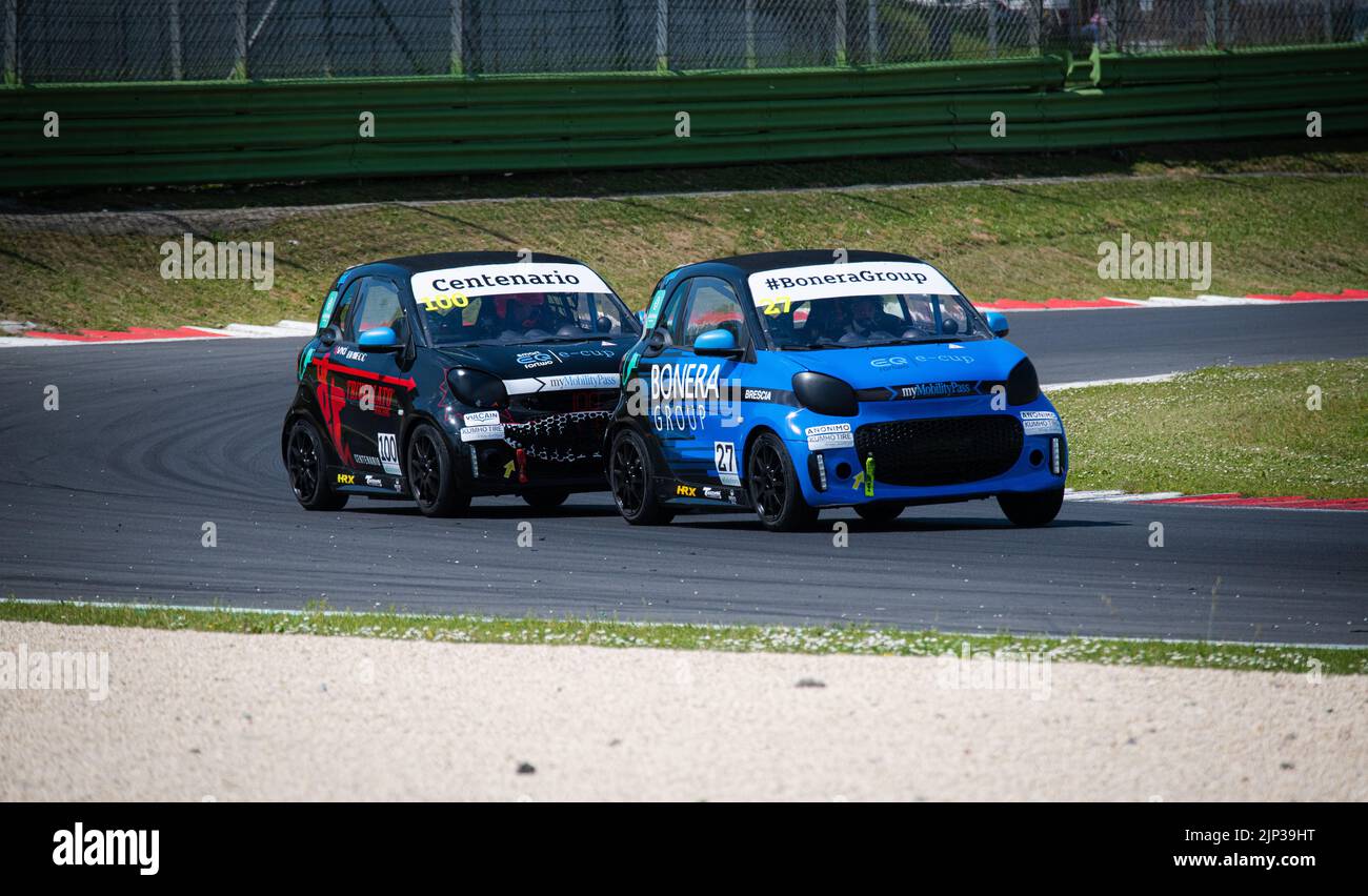 Racing Smart electric mini car action challenging on racetrack ...