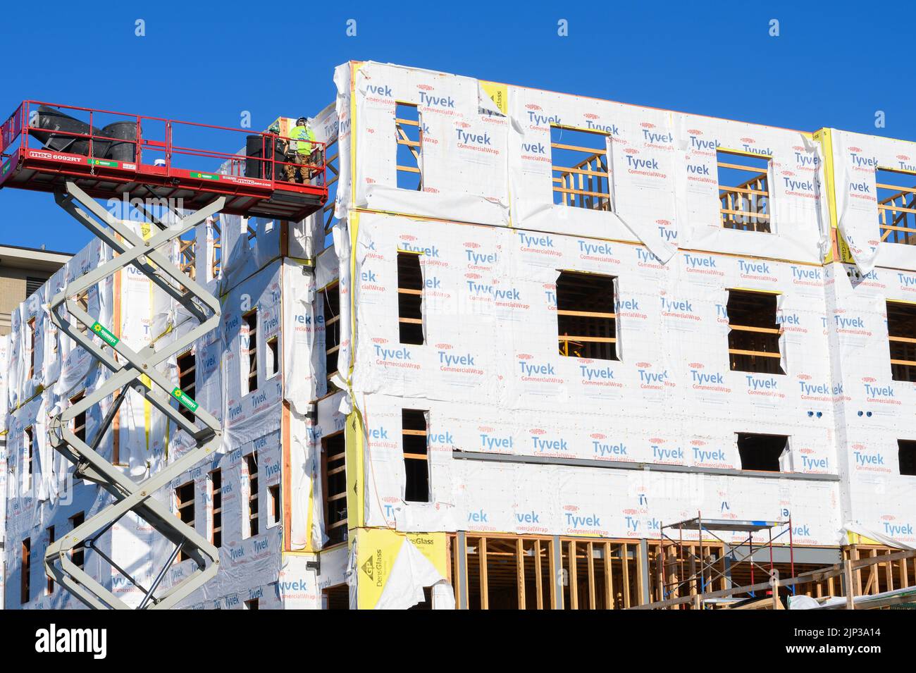 Construction in progress for a new apartment complex in downtown suburb ...