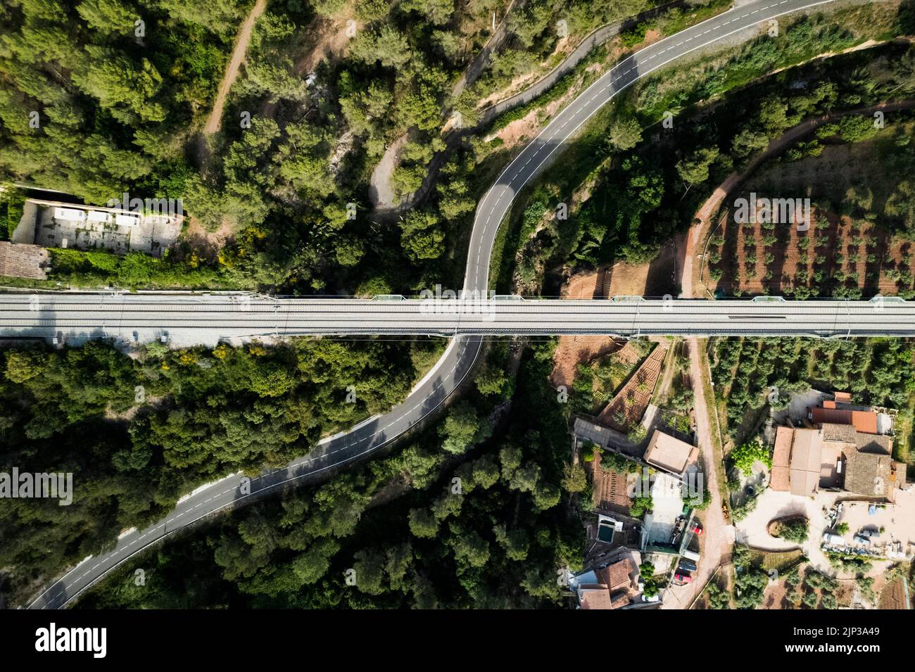 An aerial view of highway road and train tracks in the middle of the ...