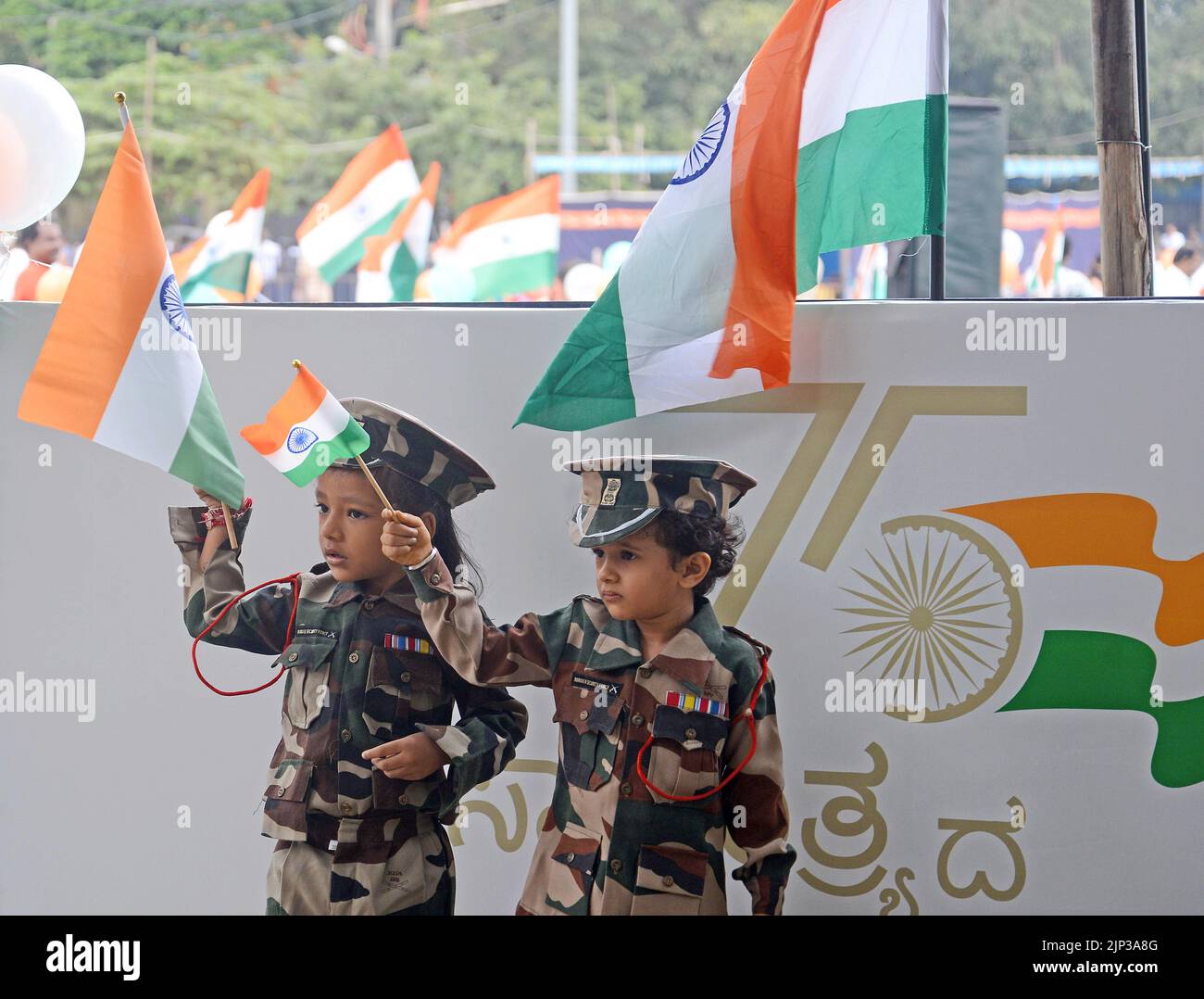Bangalore, India. 15th Aug, 2022. Children are seen waving national ...