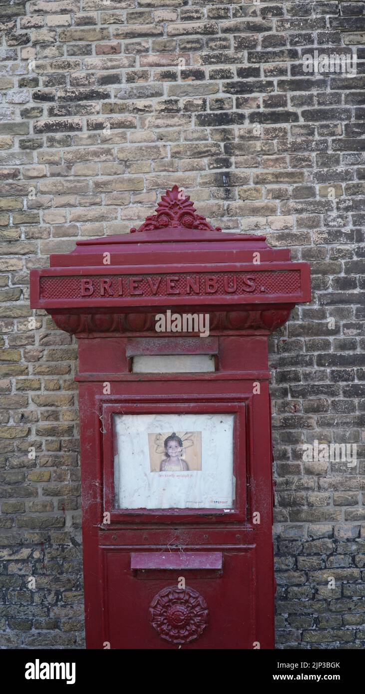 vintage red letterbox on wall Stock Photo - Alamy