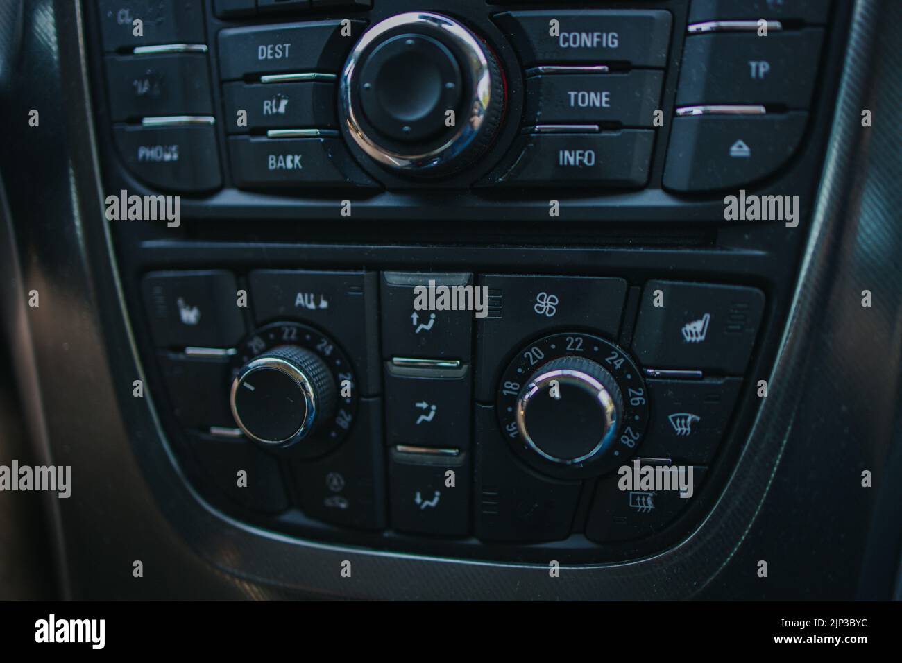 A closeup shot of a modern car's interior design with detailed buttons ...