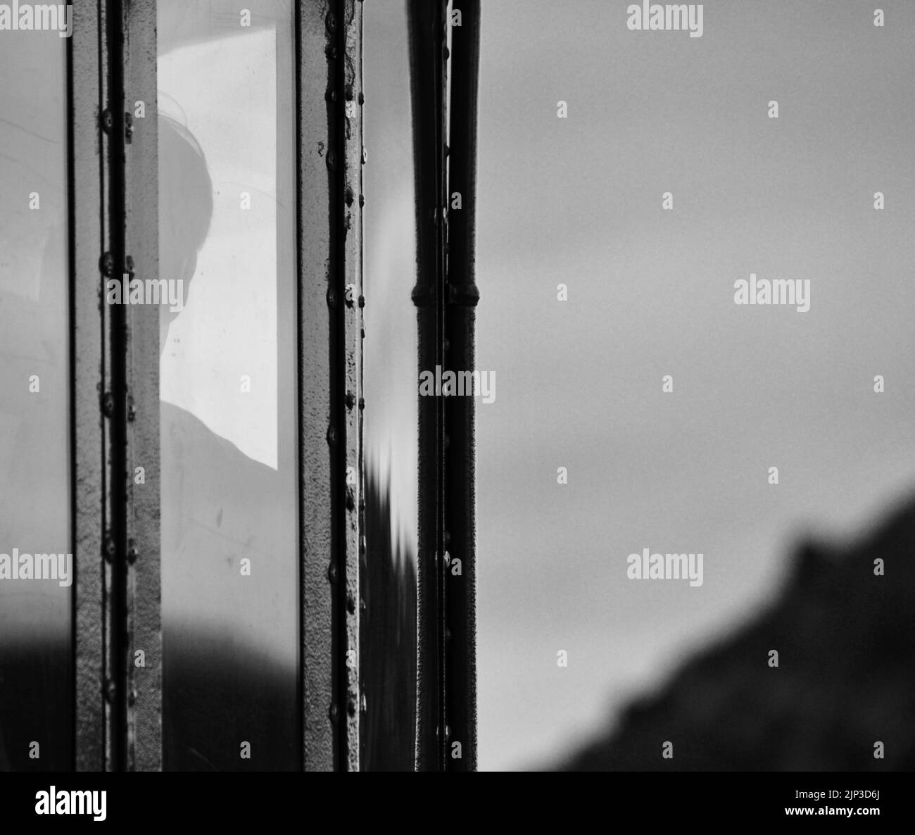 A glass window with a mans reflection Stock Photo - Alamy