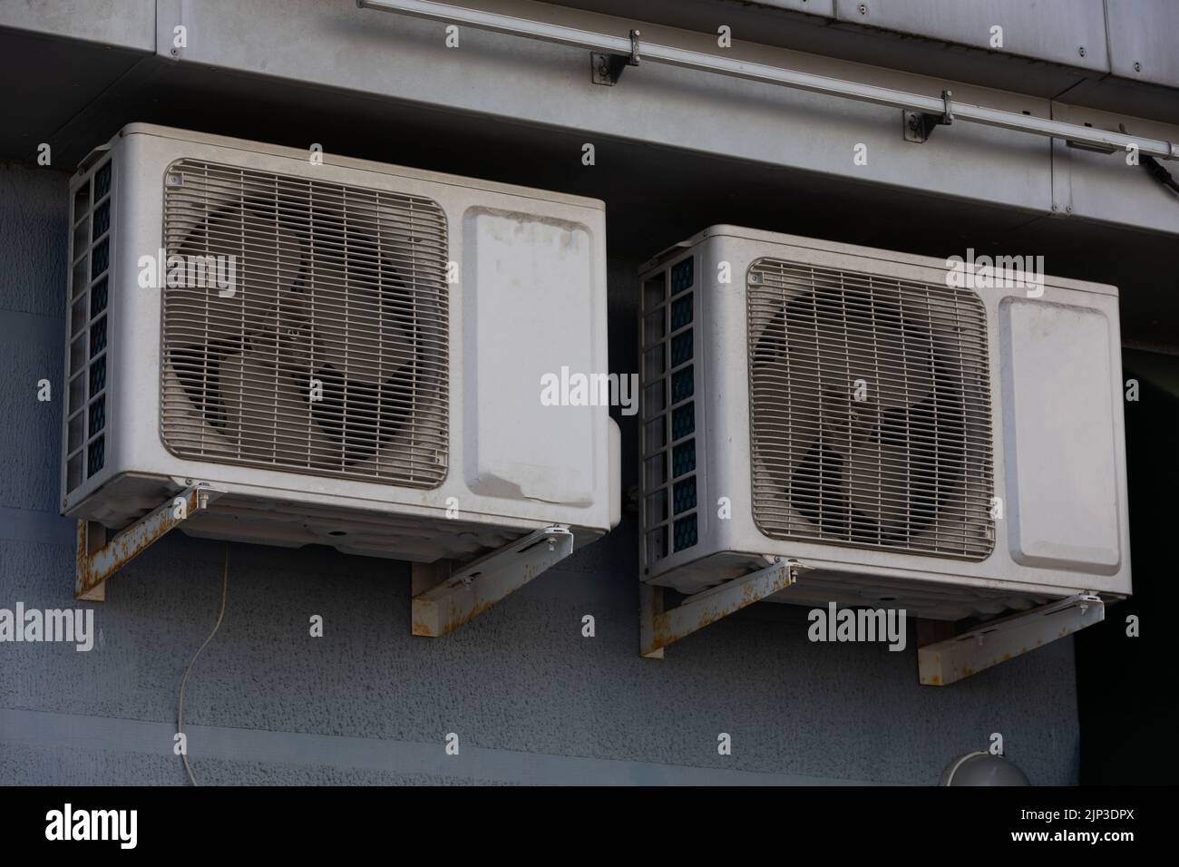 air conditioning unit Central split system hanging outside the building ...
