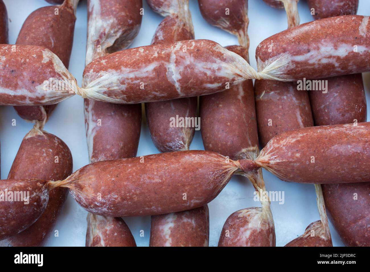 Sausages with skins hi-res stock photography and images - Alamy
