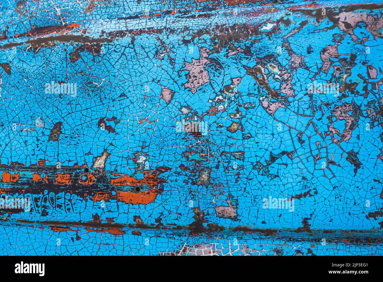 Enamelled colorful cracked and peeling surface of old motorcycle. Rusty ...