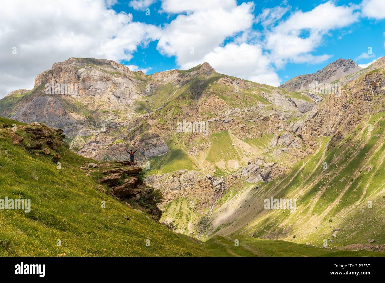 A young man looking at the landscape in the valley Stock Photo - Alamy