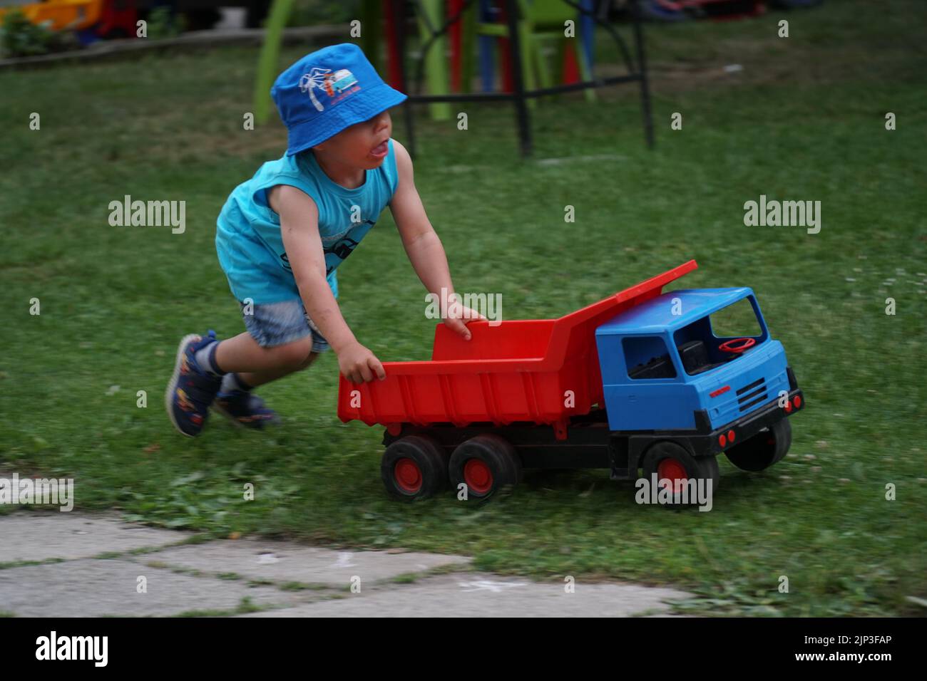 little boy push a play truck Stock Photo - Alamy