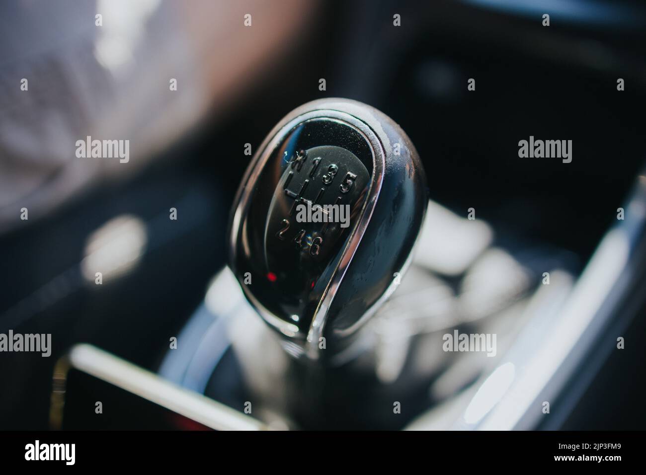 A closeup shot of a black stick shift in a car Stock Photo - Alamy