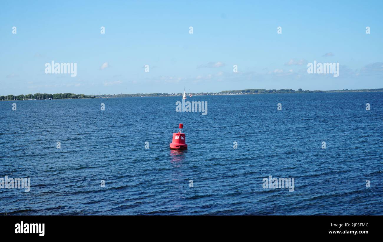 red buoy in sea Stock Photo - Alamy