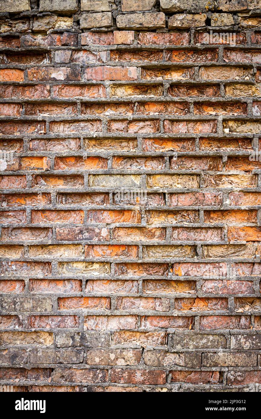 Background of yellow and red brick wall texture Stock Photo - Alamy