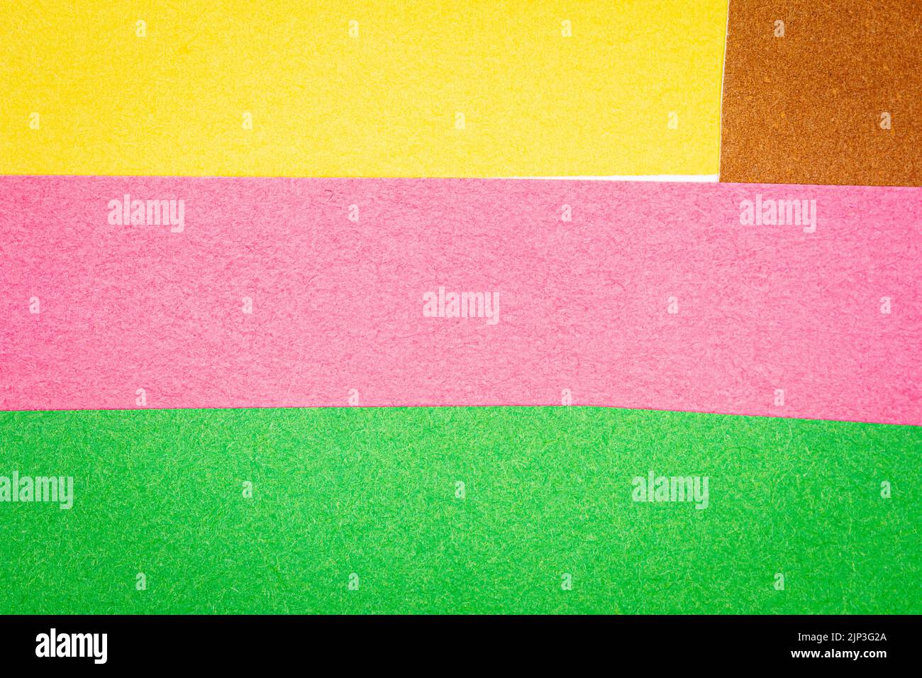 Multicolor background from a paper of different colors. Abstract ...