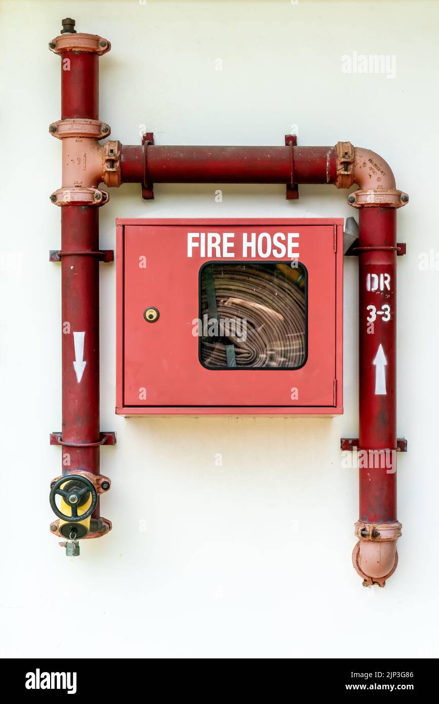 Standpipe wall hydrant with the fire hose. Fire fighting system, safety ...