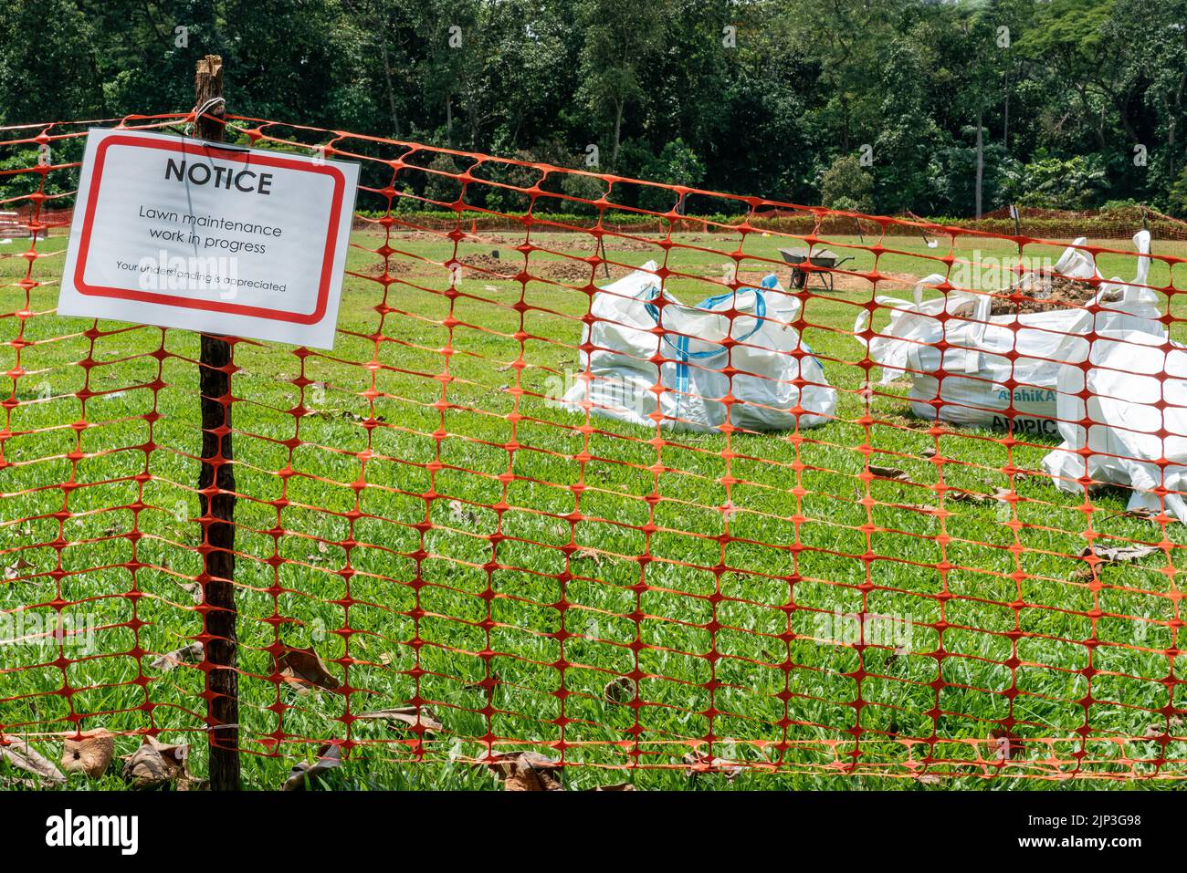 Lawn maintenance work in progress notice sign at East Coast Park ...