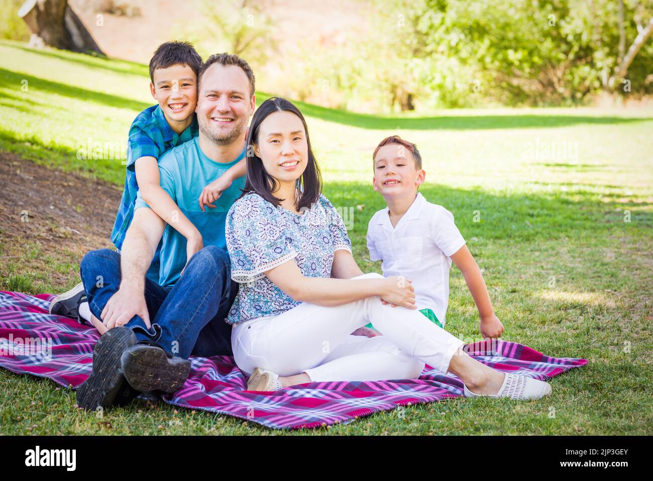 Outdoor portrait of mixed race Chinese and Caucasian family Stock Photo ...