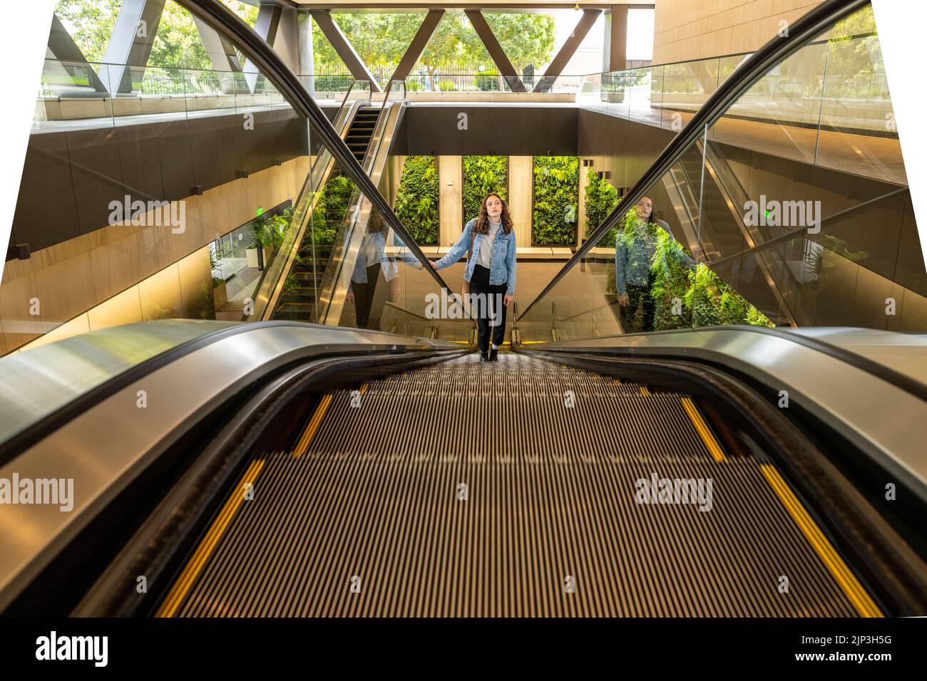 Escalator riding hi-res stock photography and images - Alamy