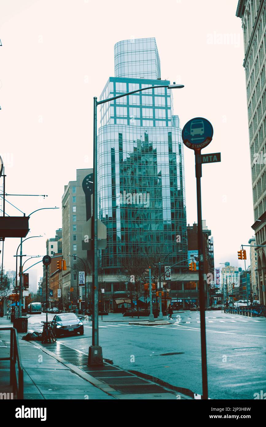A vertical shot of a modern glass building in rainy New York City Stock ...
