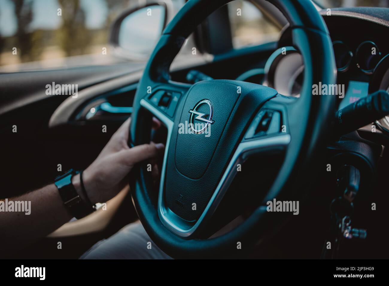 A closeup of a steering wheel with an Opel logo on Stock Photo - Alamy