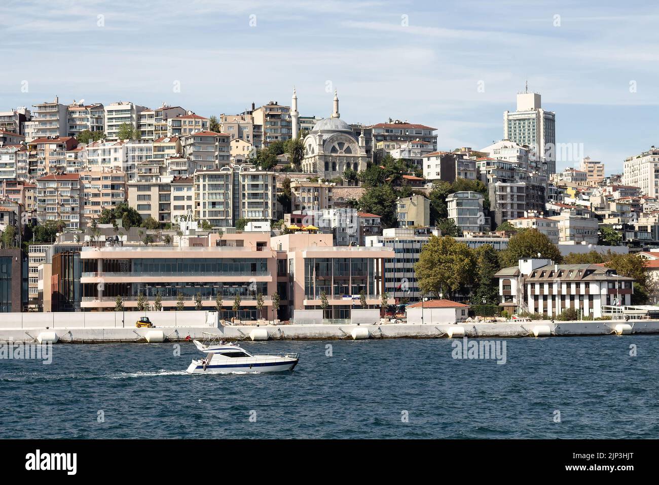 View of a yacht on Bosphorus and Gunussuyu area of Beyoglu district in ...