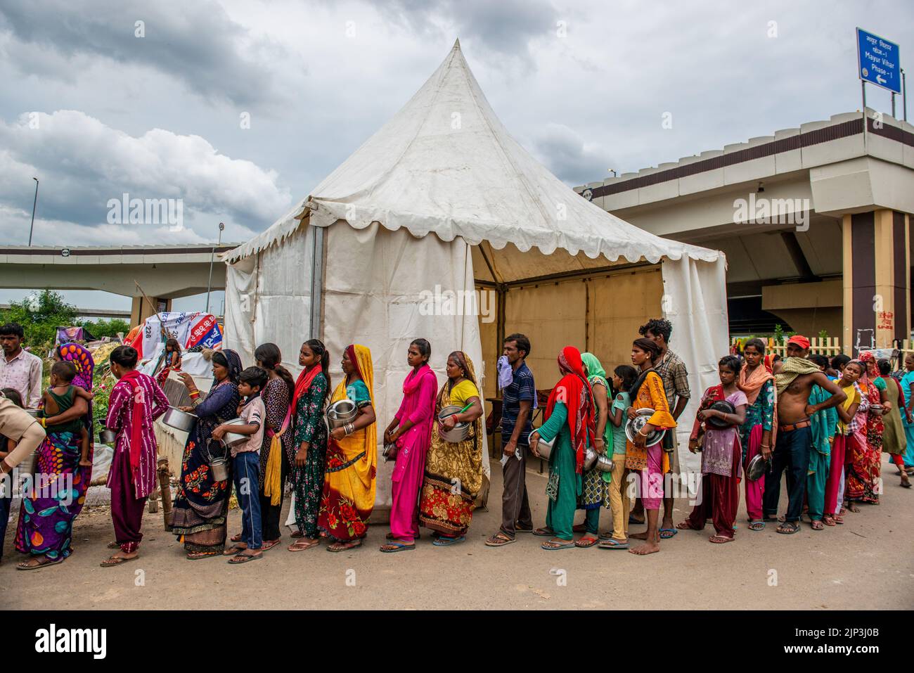 New Delhi, India. 15th Aug, 2022. Flood affected people seen in a long ...