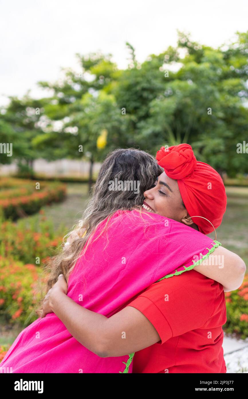 Women embrace hi-res stock photography and images - Alamy