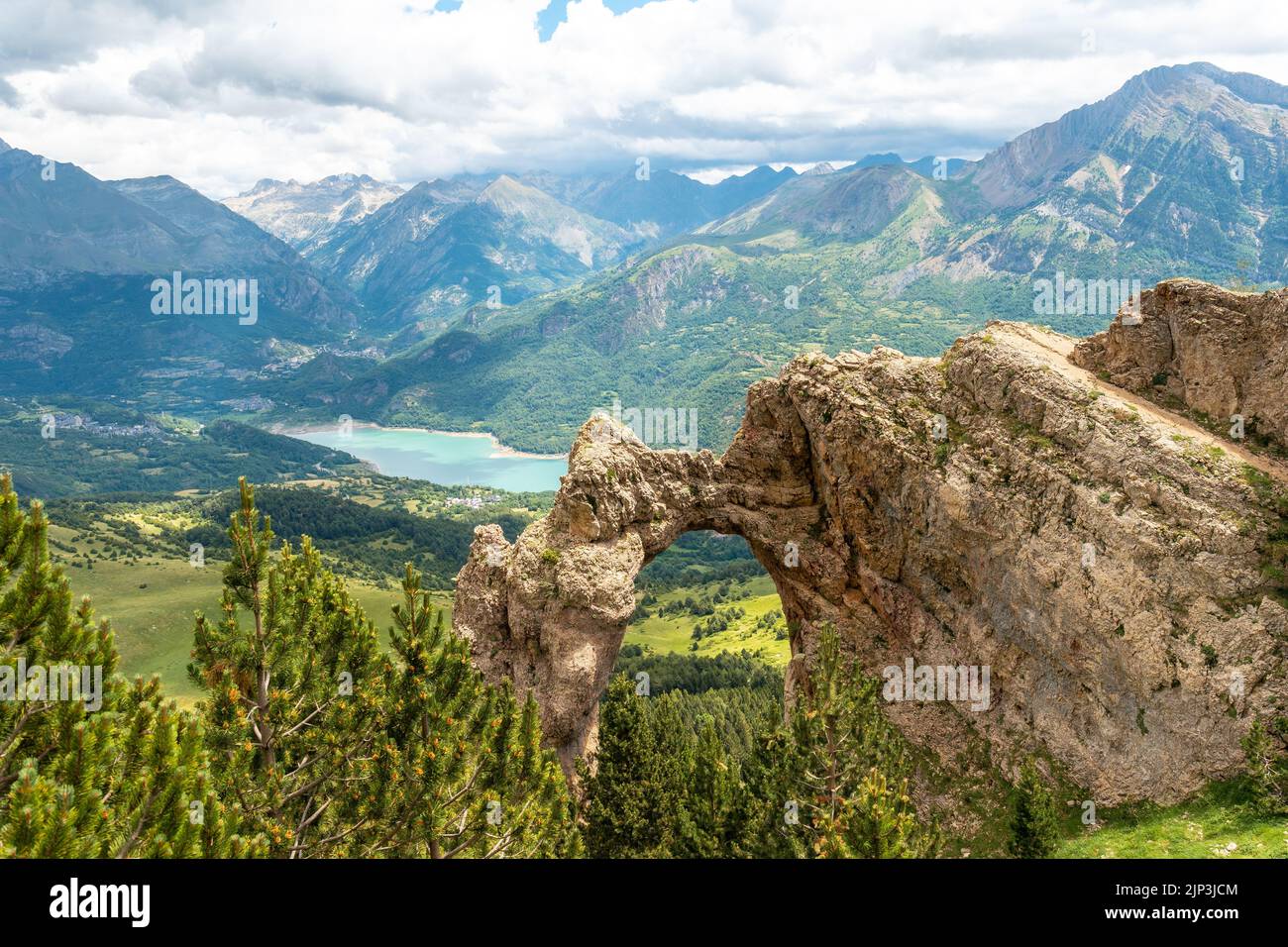 A splendid view of forests, a lake, and mountains from the Piedrafita ...