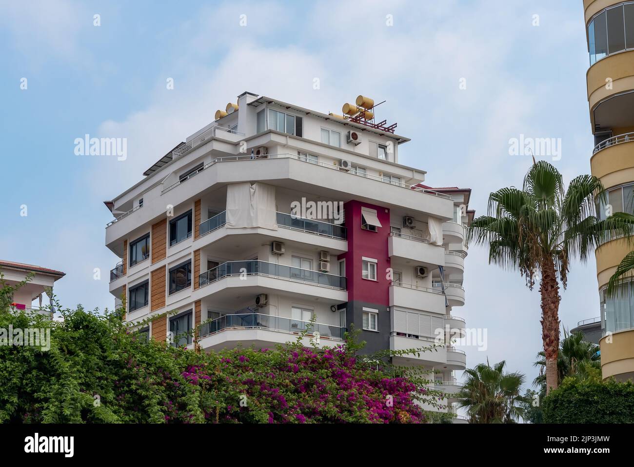 An inhabited low-rise building in southern Turkey. House surrounded by ...