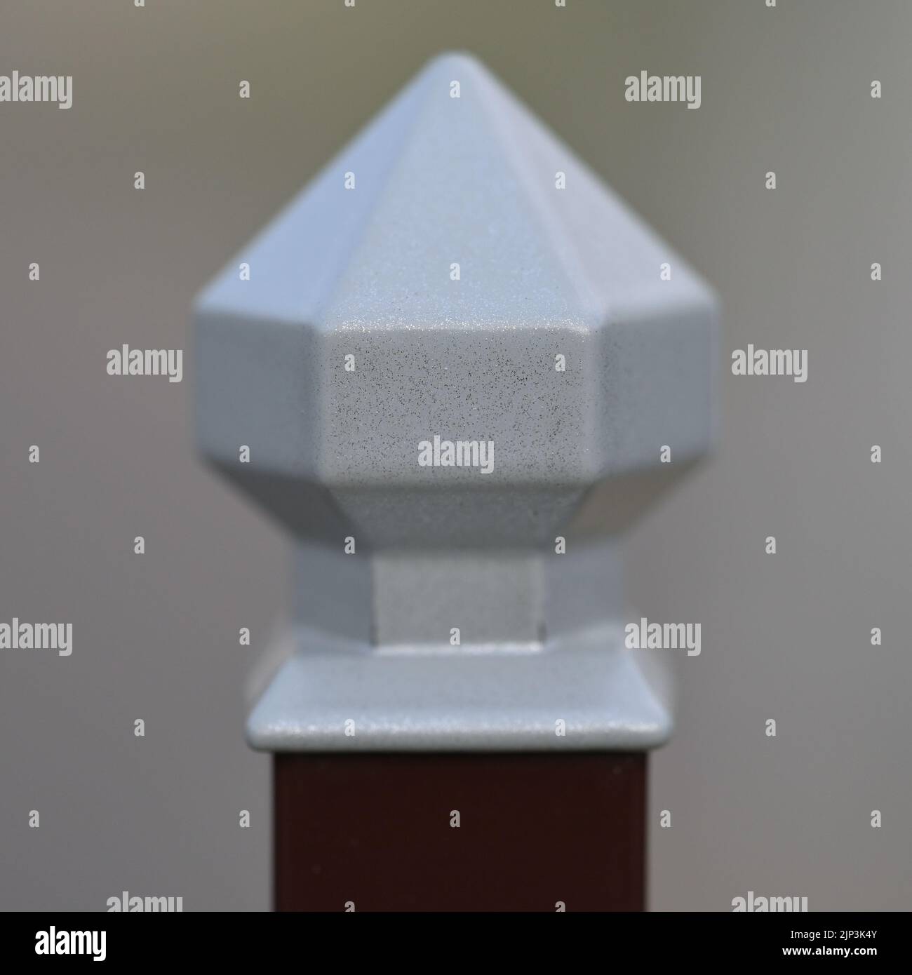 A white tip of a signal post or a barrier Stock Photo - Alamy