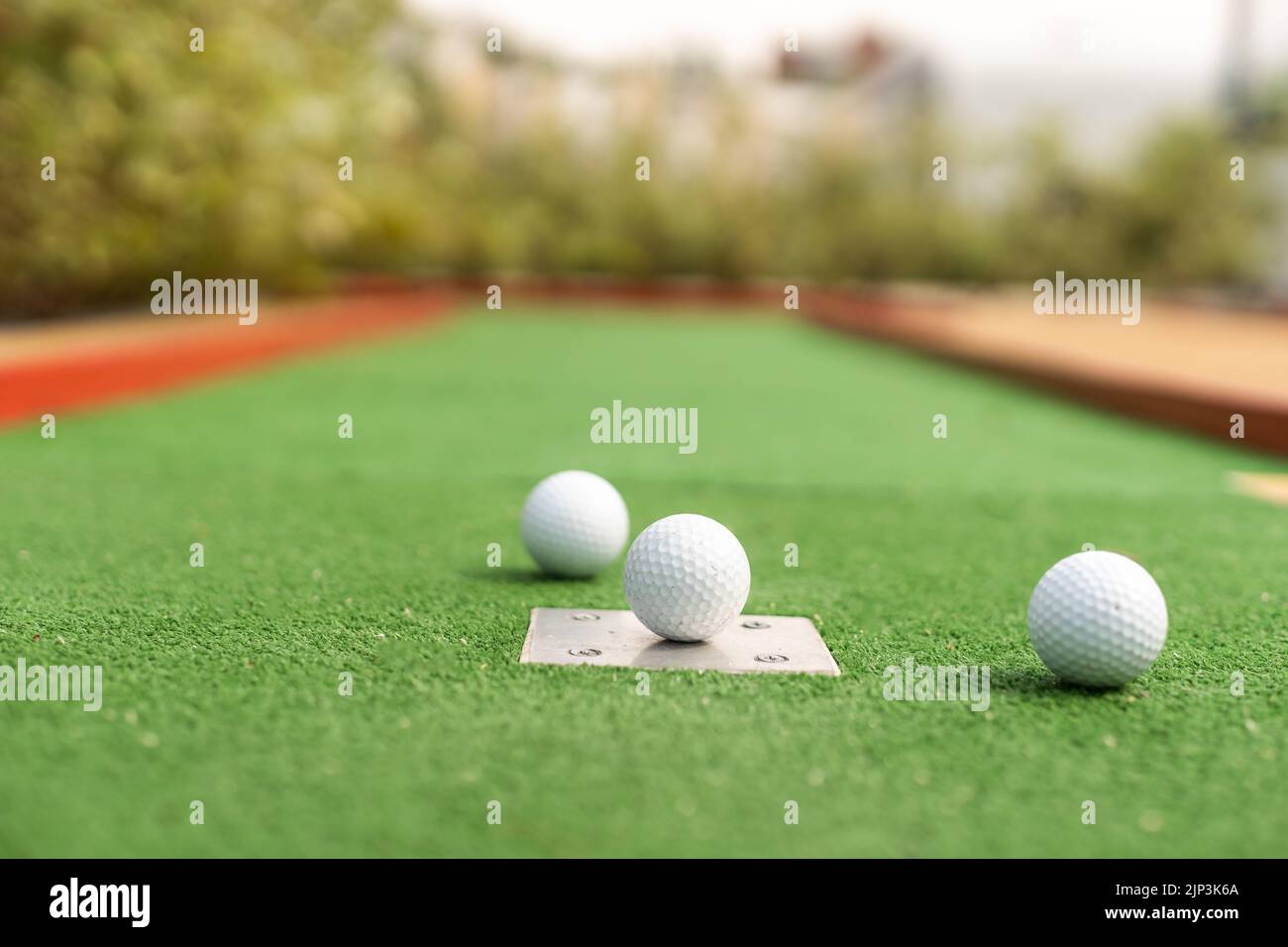 Mini-golf ball on artificial grass. Summer season game Stock Photo - Alamy