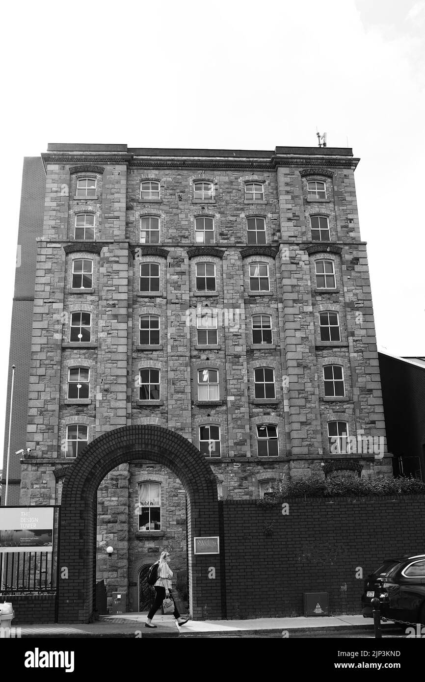 A grayscale of an old creepy stone building Stock Photo - Alamy