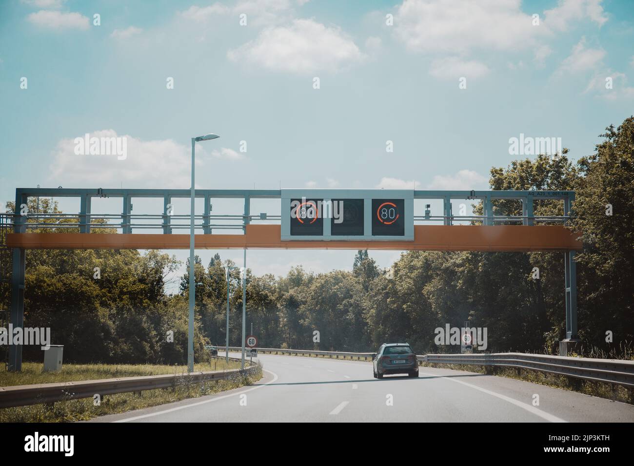 A highway traffic sign in Vienna, Austria with blue sky background ...