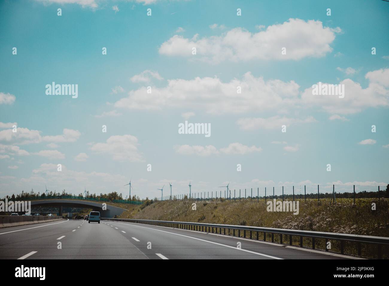 A highway traffic in Vienna, Austria with blue cloudy sky background ...