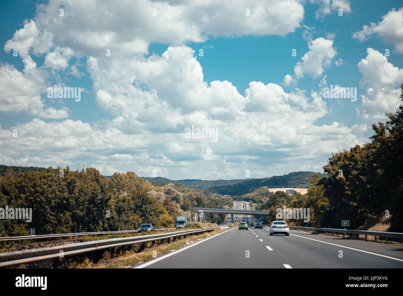 A highway traffic in Vienna, Austria with blue cloudy sky background ...