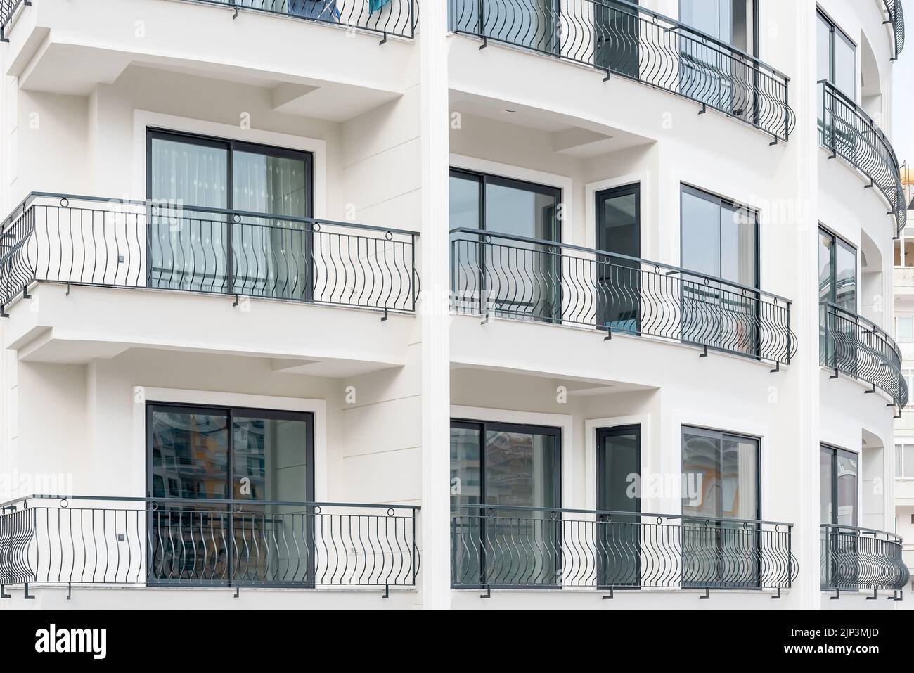 New freshly built white house with large windows. Modern architecture ...