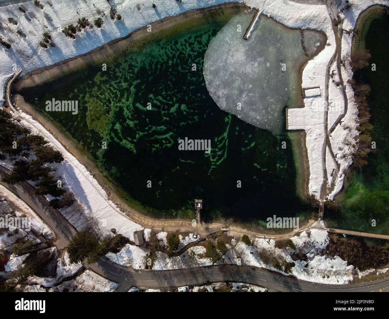 bird's-eye view of Jezero Jasna. Icy man-made lake in Slovenia. Snowy ...