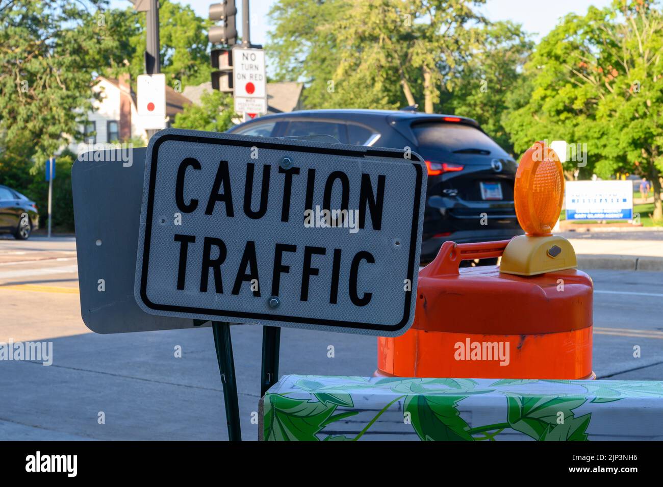 Caution Traffic sign downtown city crosswalk on a summer, sunny morning ...